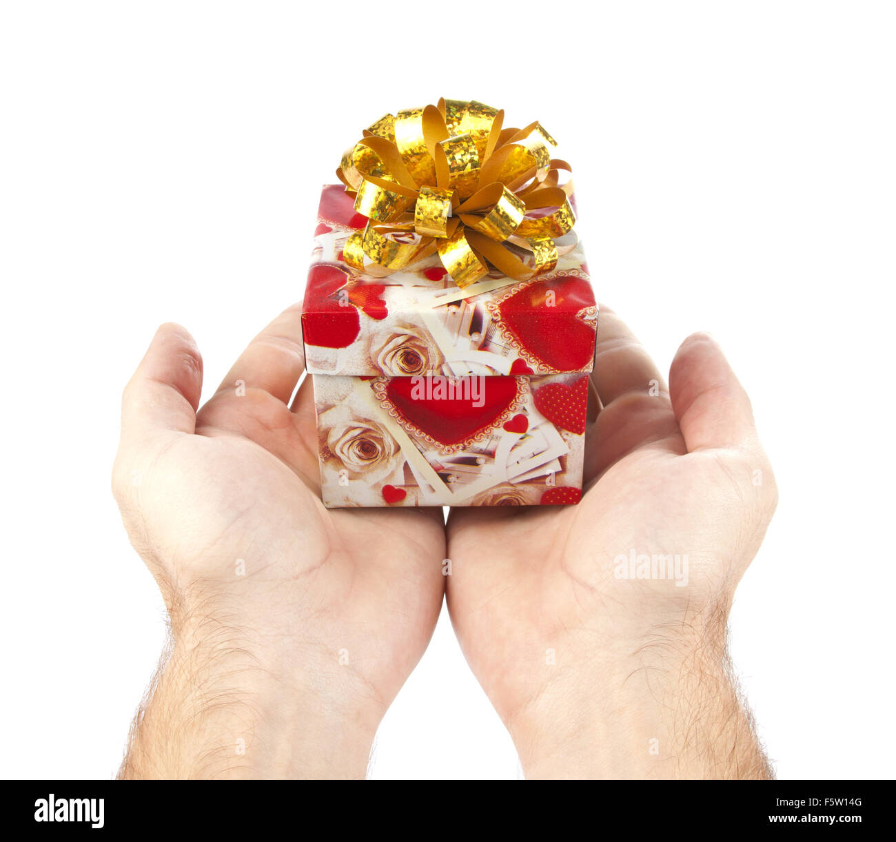Small red gift in palms of hands. Isolated on white Stock Photo - Alamy