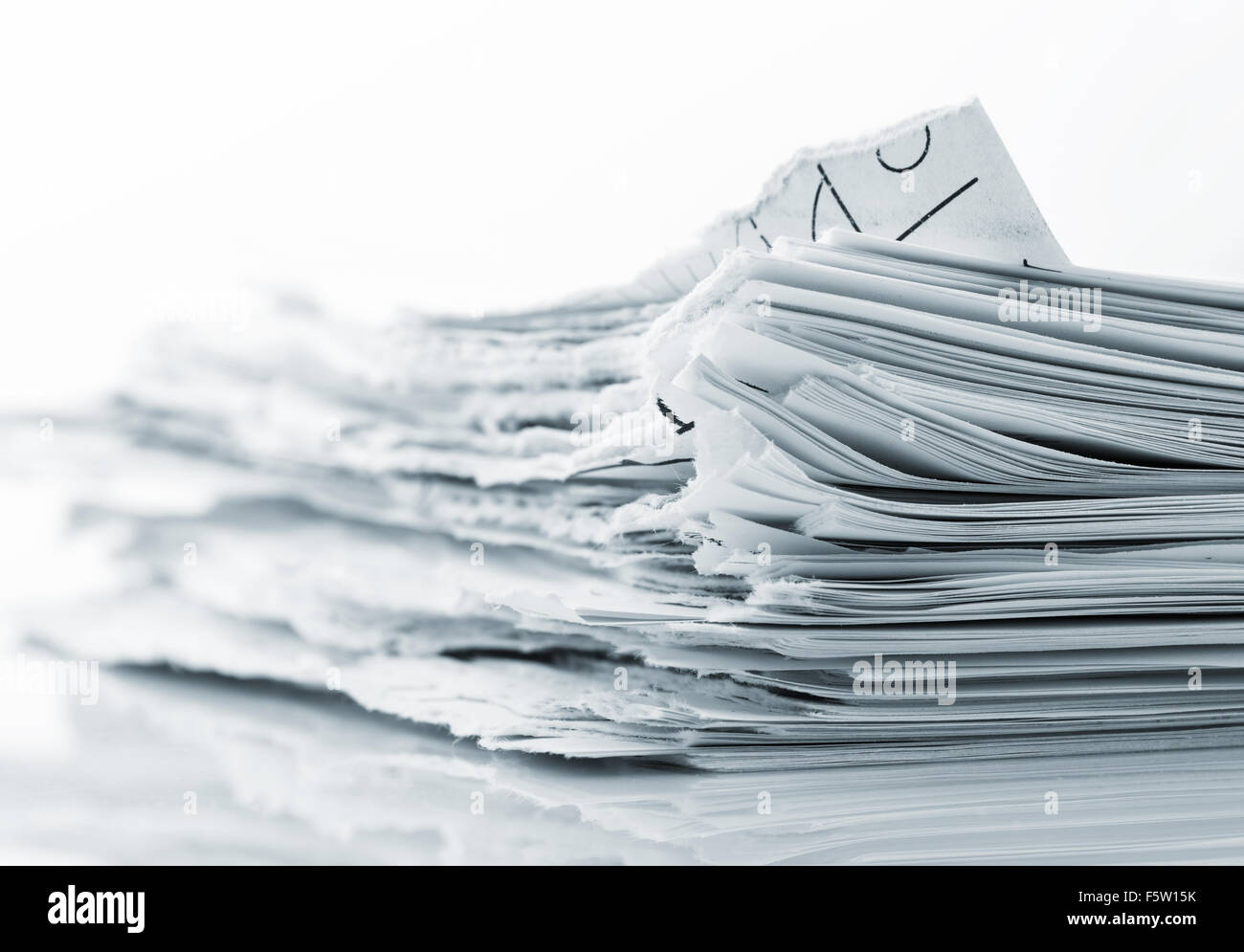 Pile of ragged paper sheets closeup picture Stock Photo - Alamy
