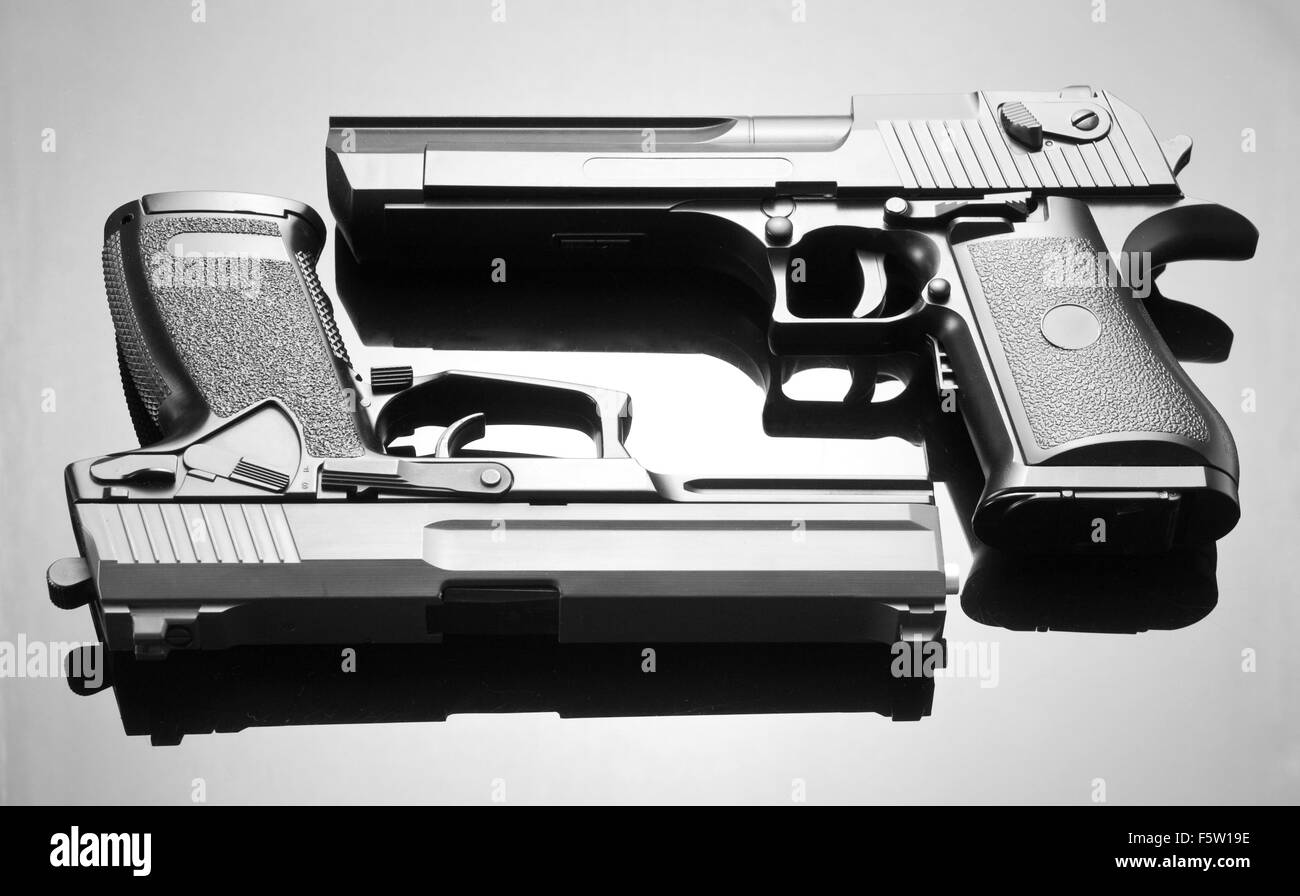 Two handguns. Desert Eagle and M23 Double Eagle Stock Photo - Alamy