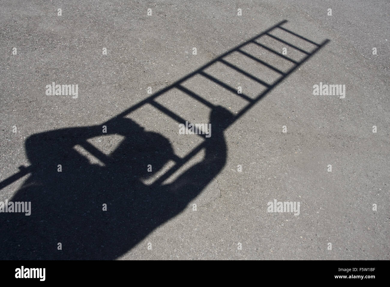 Shadow of man climbing ladder on asphalt Stock Photo - Alamy