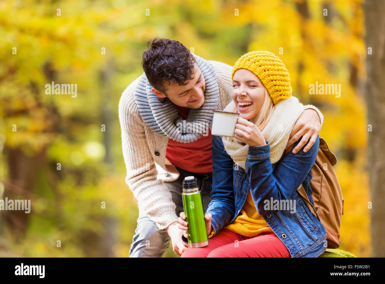Beautiful couple in autumn forest Stock Photo - Alamy