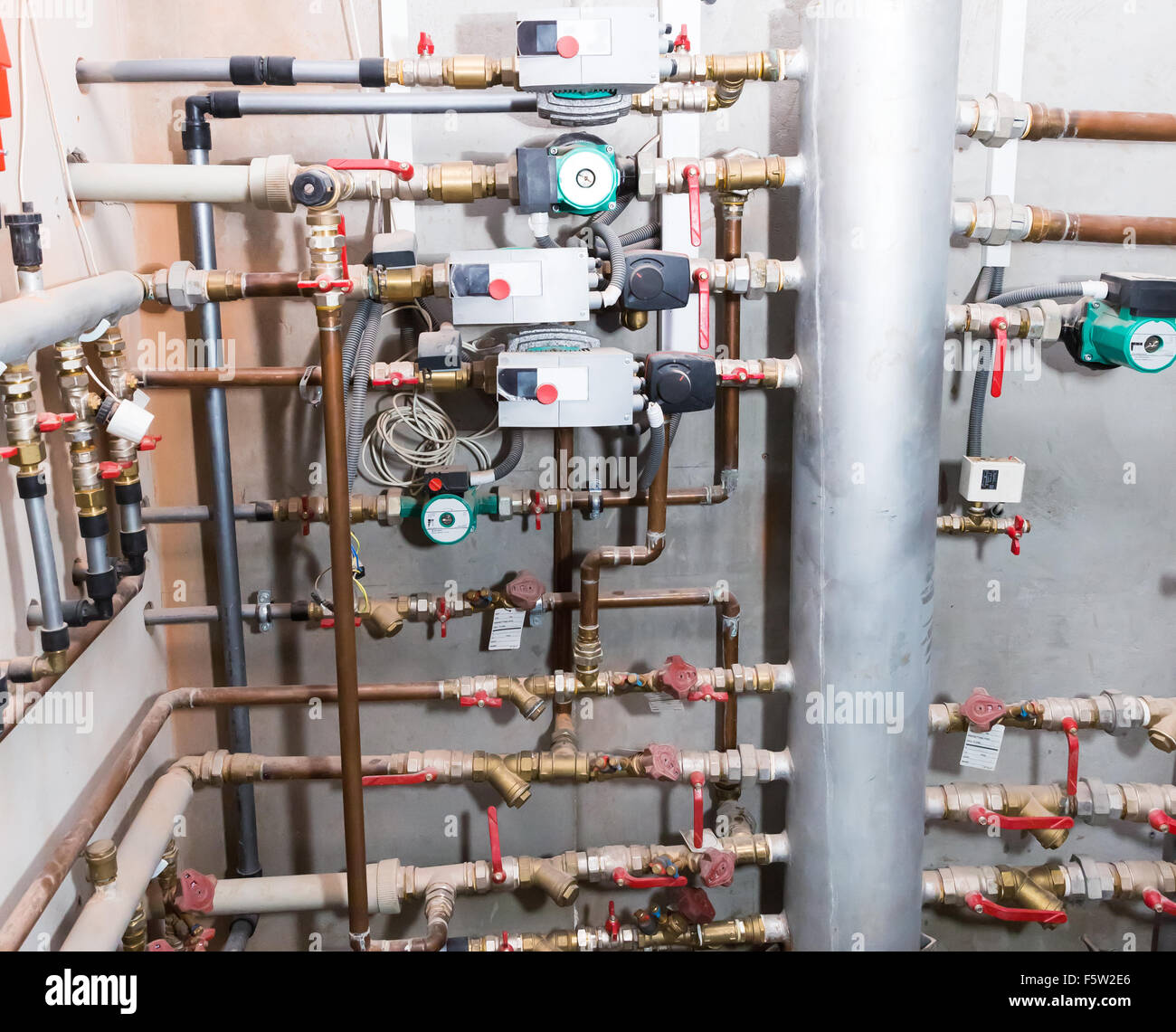 Pipes and valves of heating system indoor shot Stock Photo - Alamy