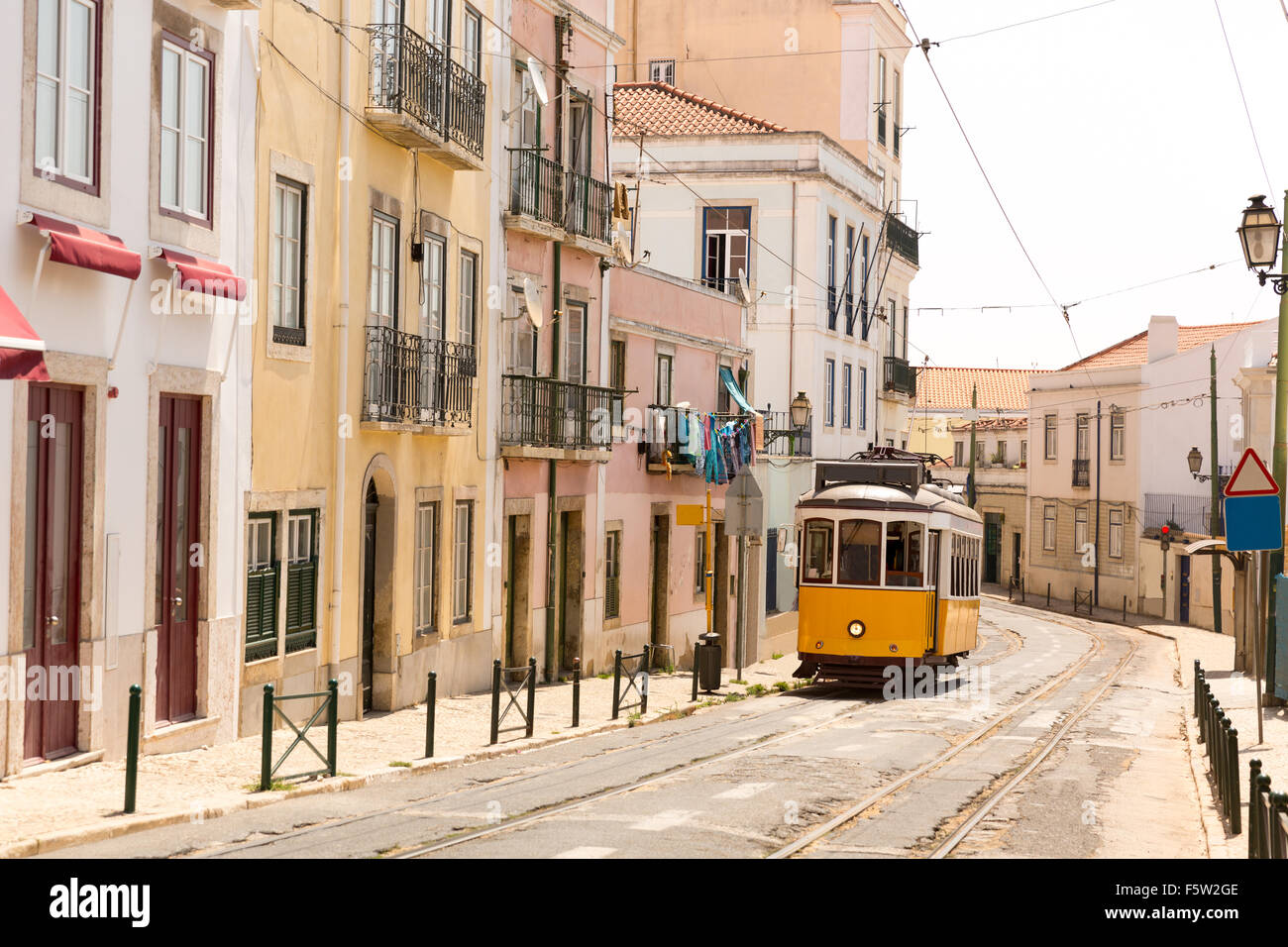 Old tram on narrow european street Stock Photo - Alamy