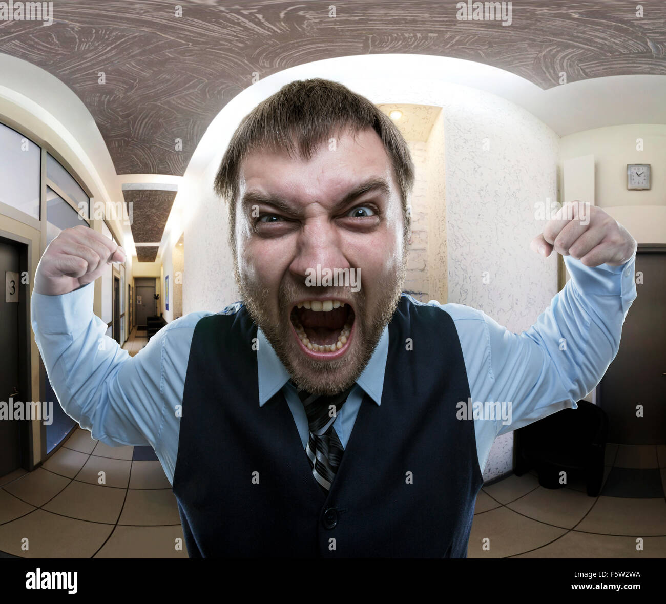Crazy businessman screaming at the office Stock Photo - Alamy