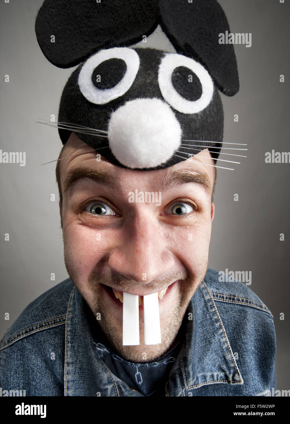 Portrait of funny man in rabbit hat Stock Photo - Alamy