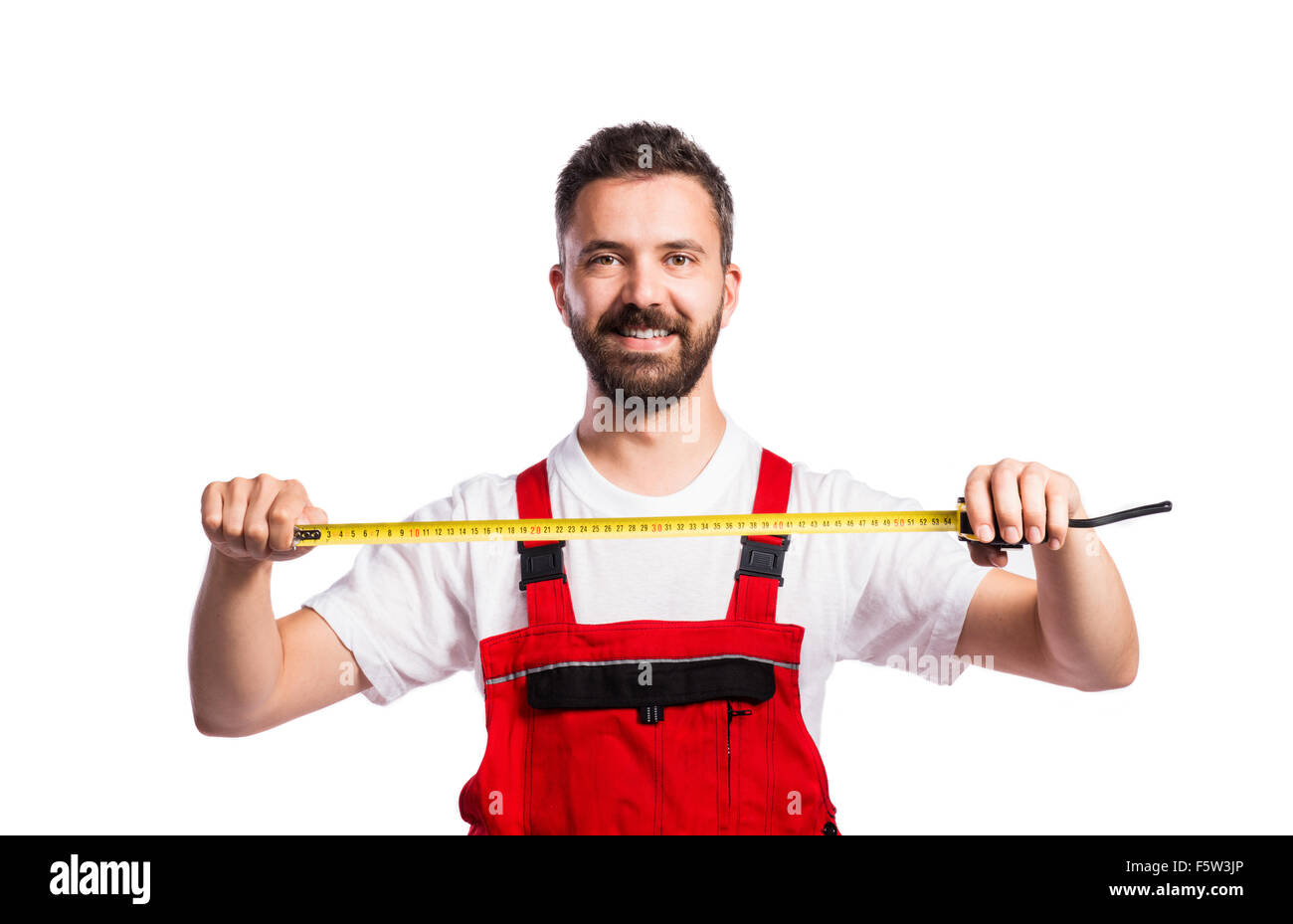 Handsome man holding measuring tape hi-res stock photography and images ...