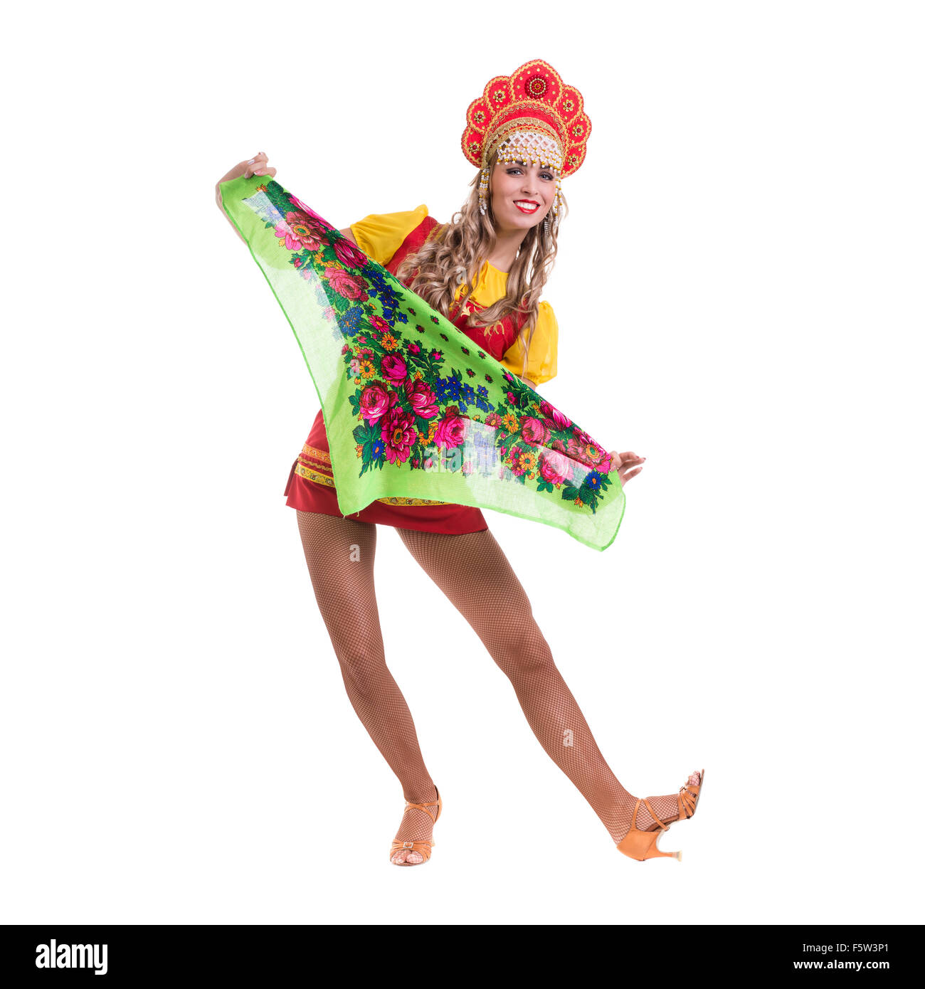Young woman wearing a folk costumes dancing. Isolated on white in full ...