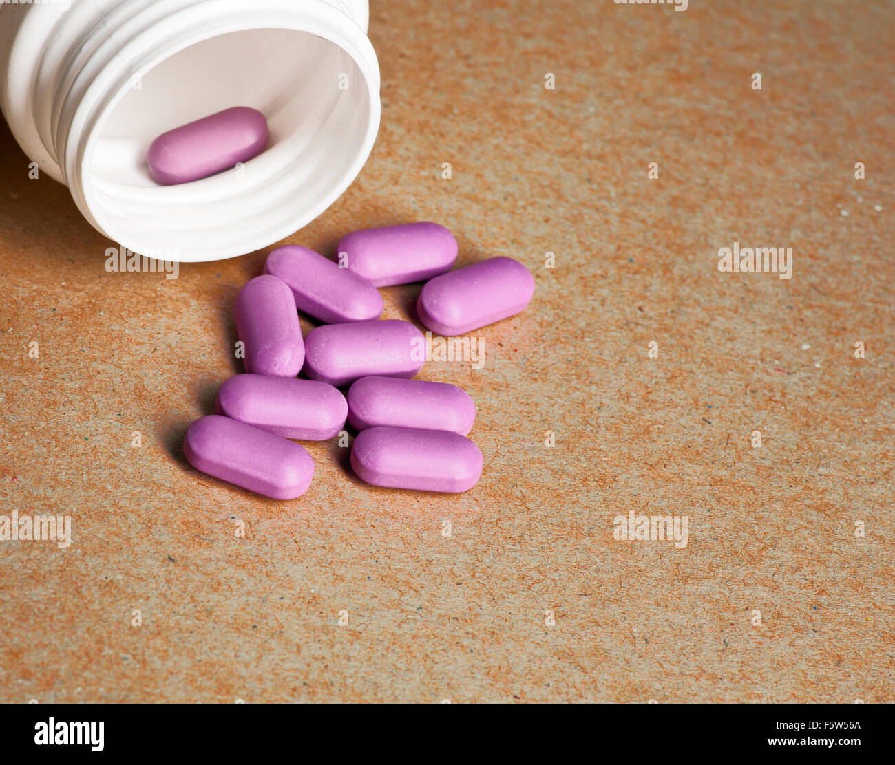 Closeup pill spilling from container hi-res stock photography and ...