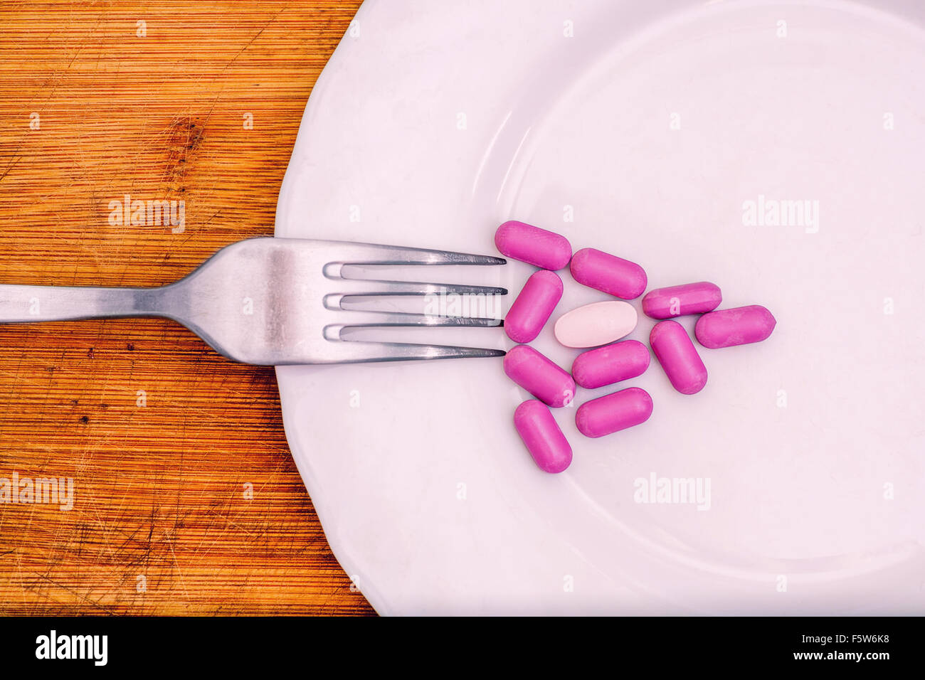 Pink pills in form triangle hi-res stock photography and images - Alamy
