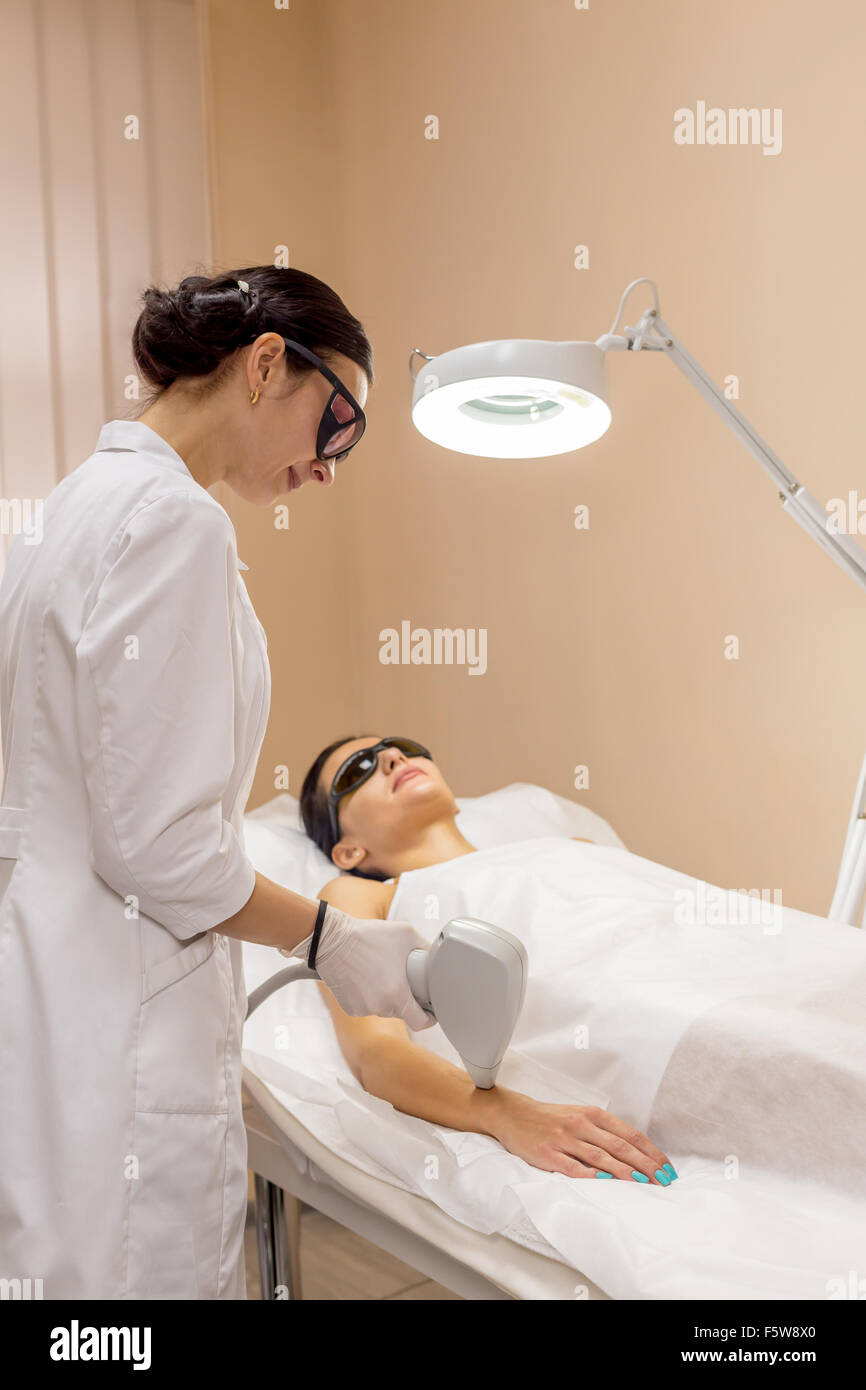 Laser depilation and skincare treatment in spa Stock Photo - Alamy
