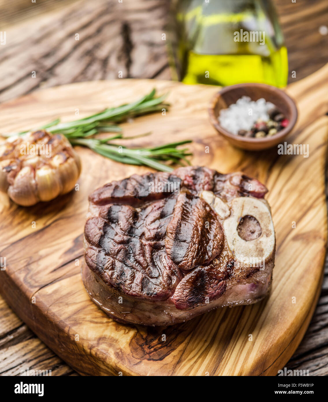 Beef steaks with spices on a wooden tray Stock Photo - Alamy