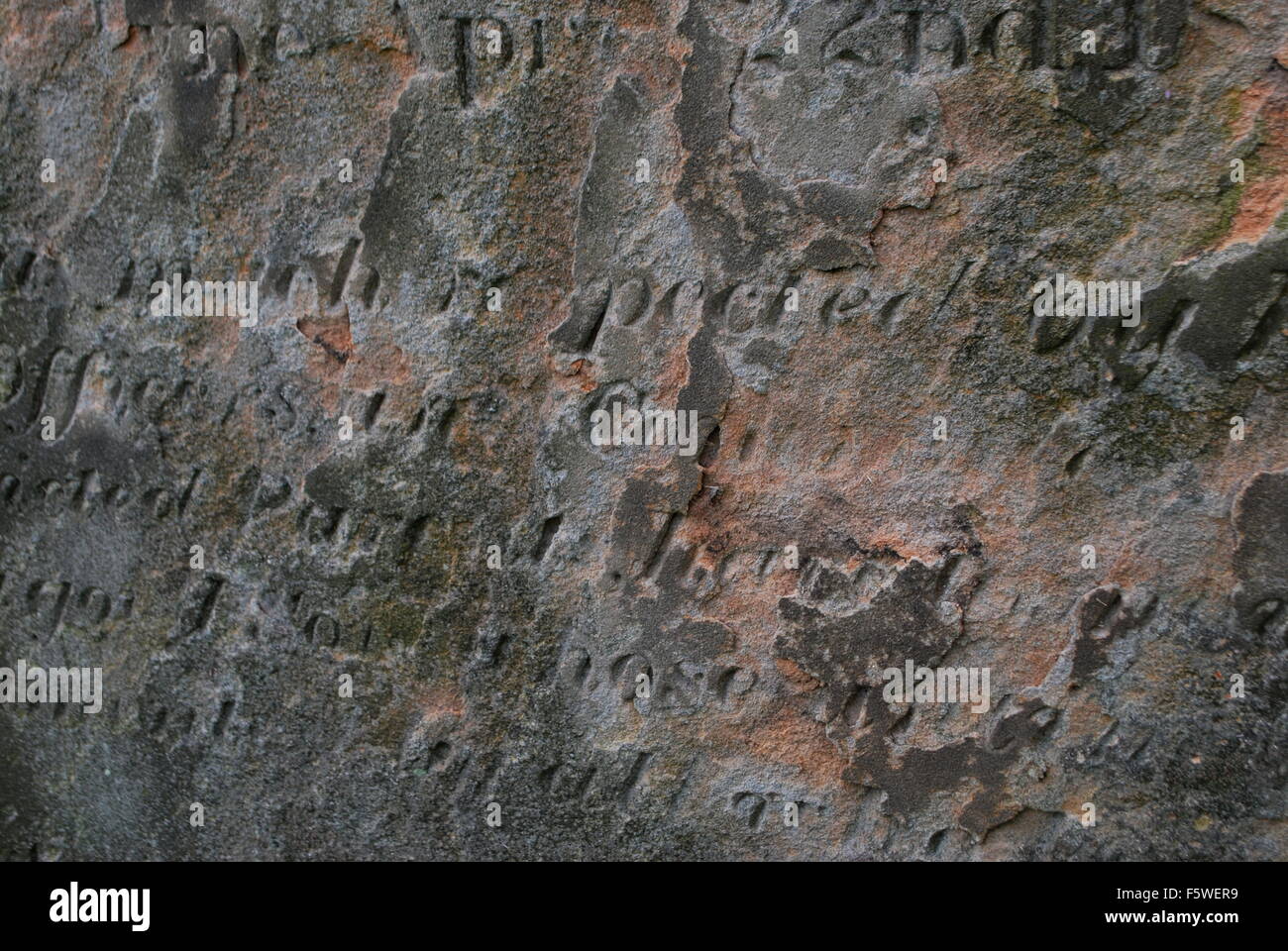 Weathered carved text Stock Photo - Alamy