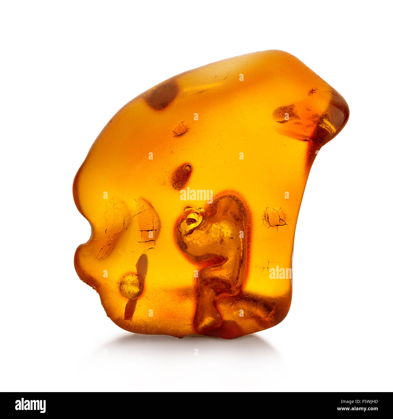Piece of amber isolated on white background Stock Photo - Alamy
