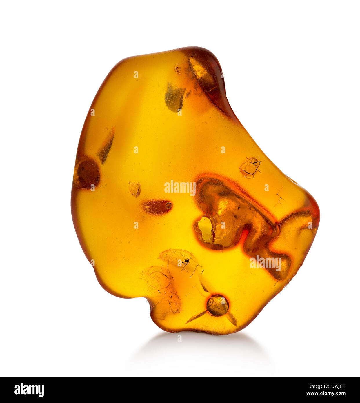 Piece of amber isolated on white background Stock Photo - Alamy