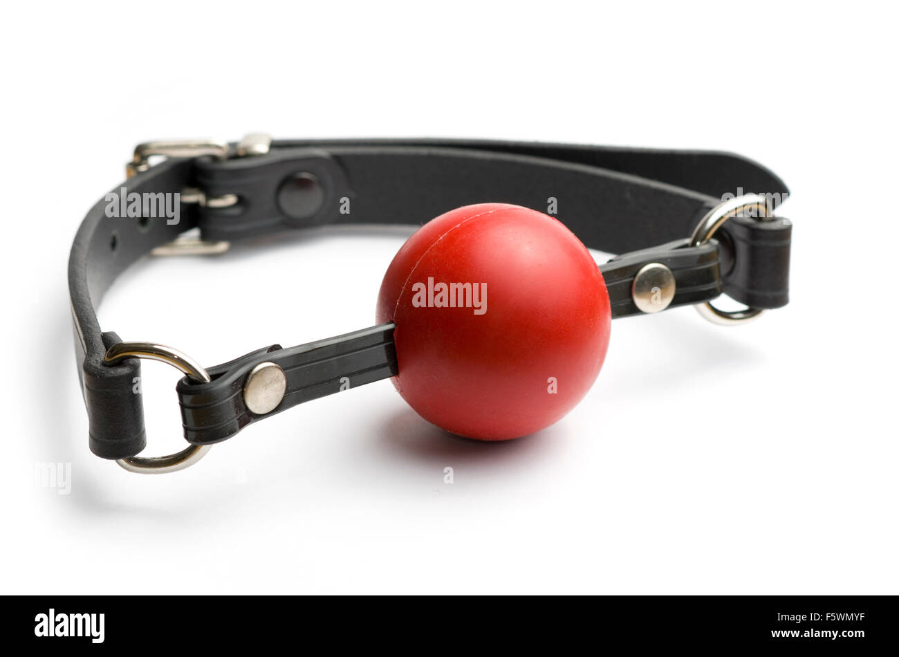 Red ball gag on white background Stock Photo - Alamy
