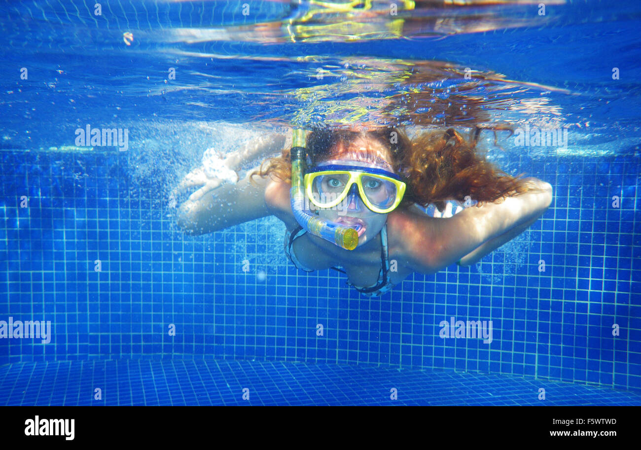Woman with mask in pool underwater Stock Photo - Alamy