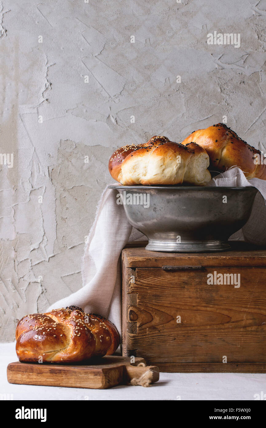 Heap of sweet round sabbath challah bread with white and black sesame ...