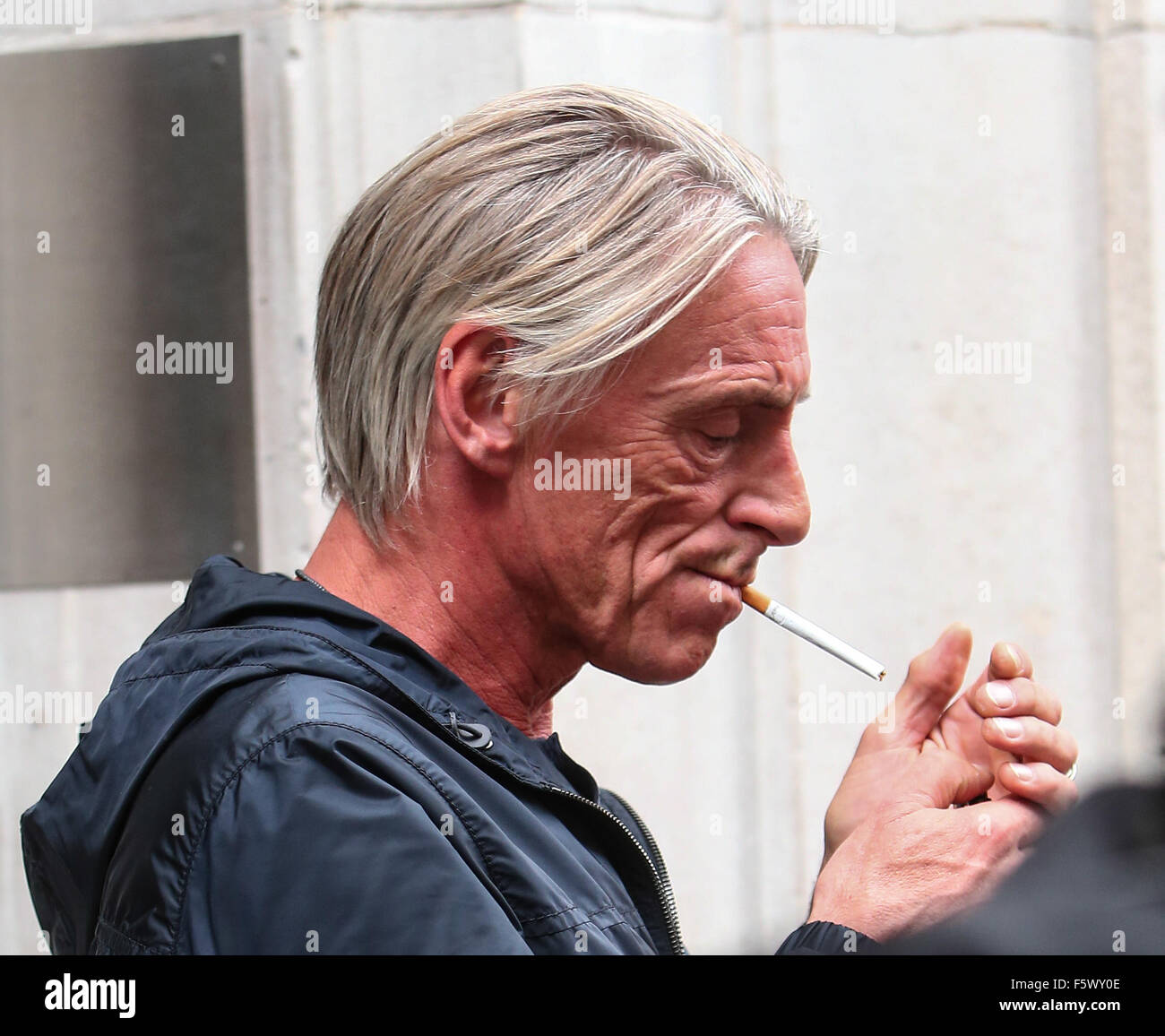 Paul Weller smoking a cigarette outside the BBC Radio 6 studios ...