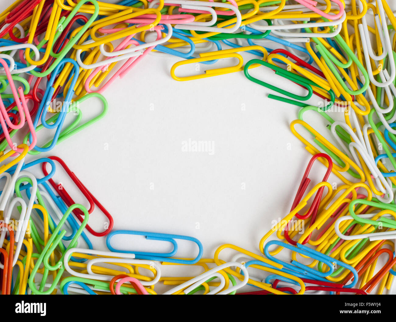 Frame of many small colorful paper clips Stock Photo - Alamy