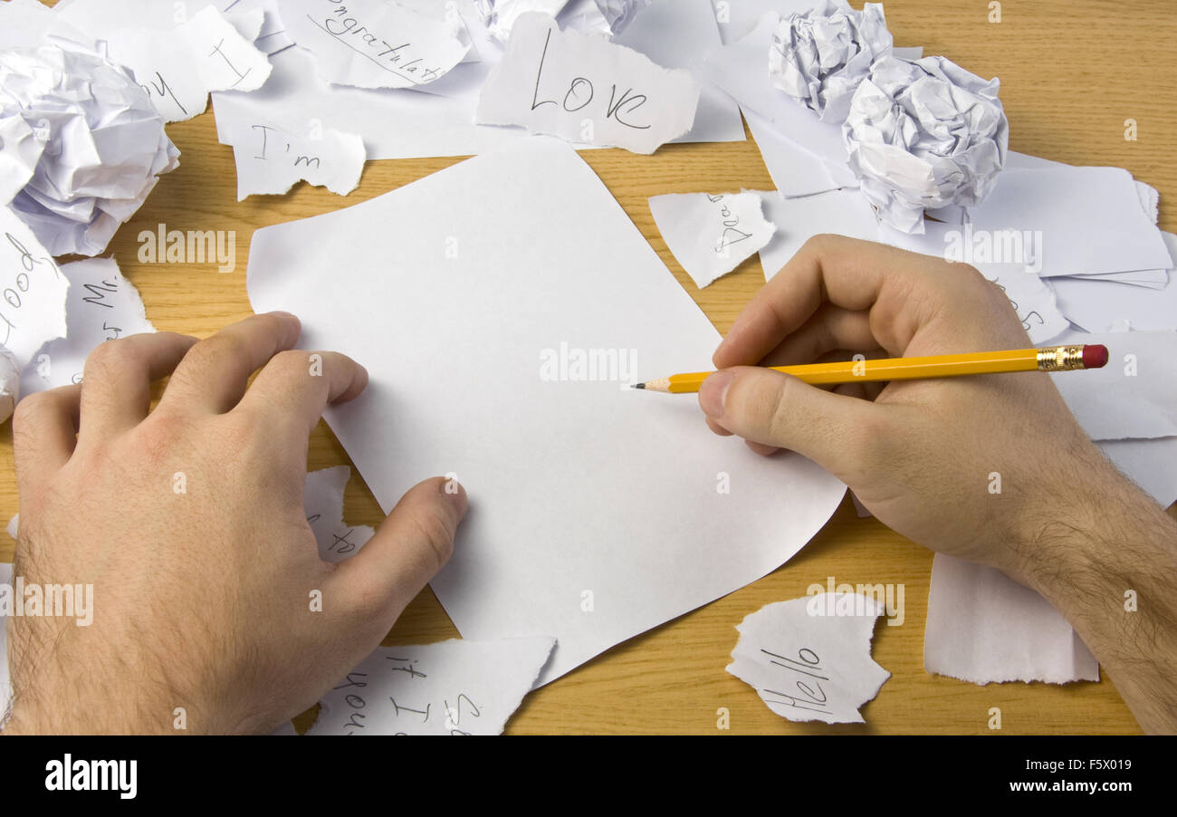 Workspace with crushed paper and hands. Pieces of letter Stock Photo ...