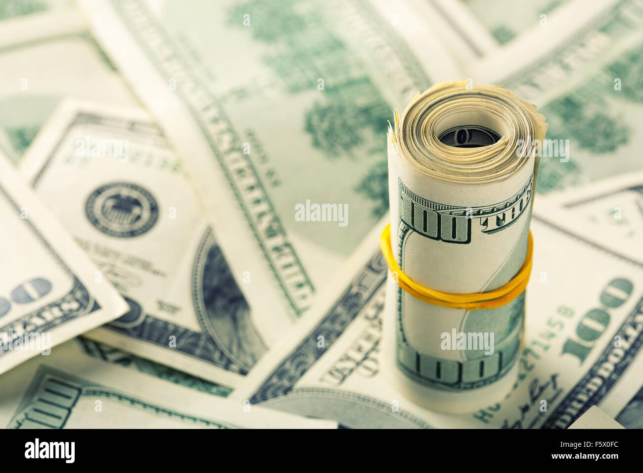 Rolled one hundred dollar hi-res stock photography and images - Alamy