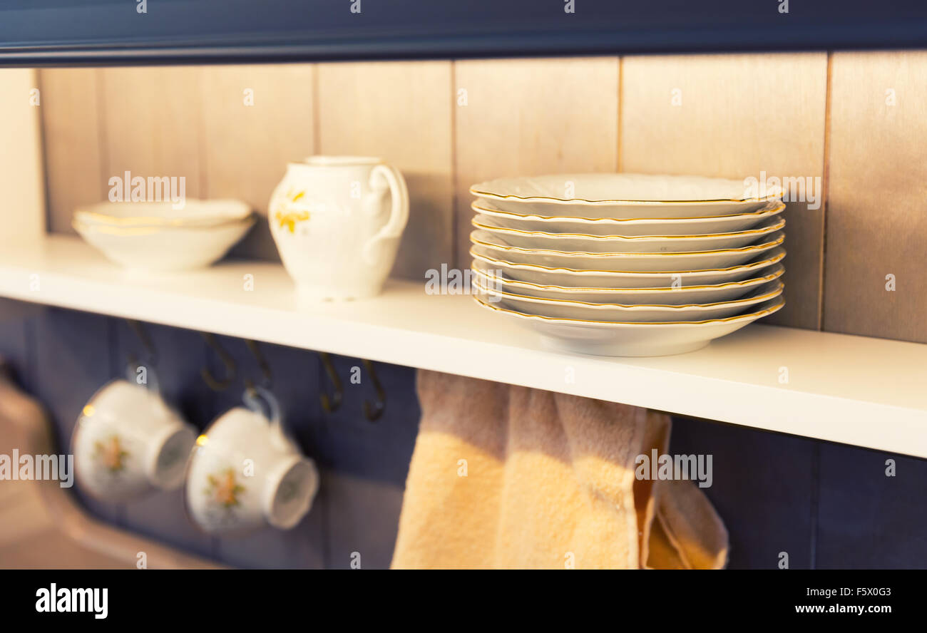 Picture of white plates and dinnerware in a cupboard Stock Photo - Alamy