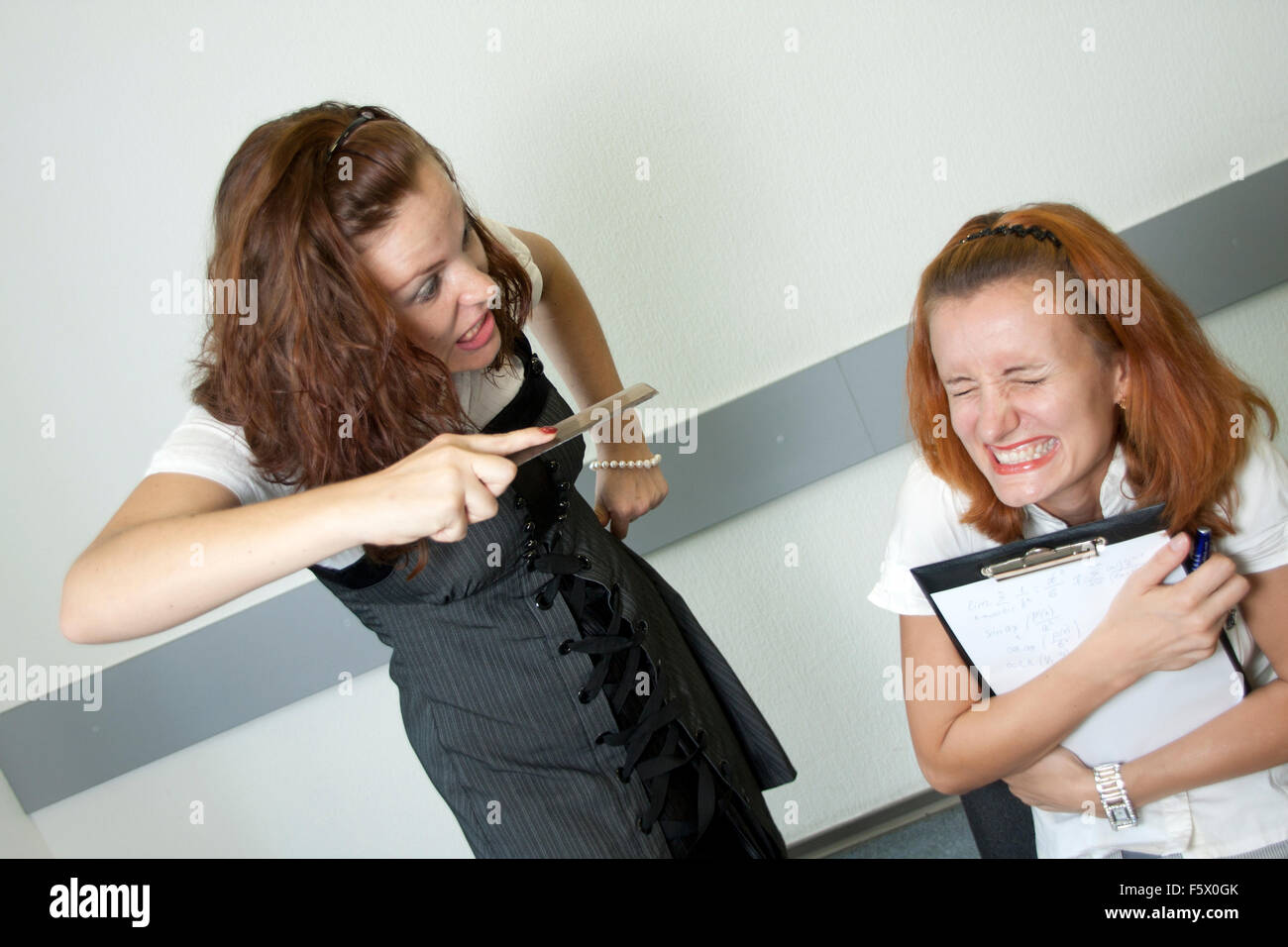 Anger teacher and afraid student Stock Photo - Alamy