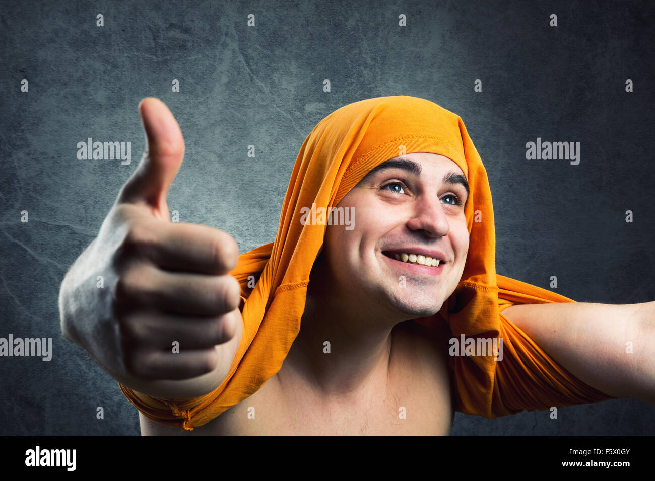 Crazy real people with yellow textile on head Stock Photo - Alamy