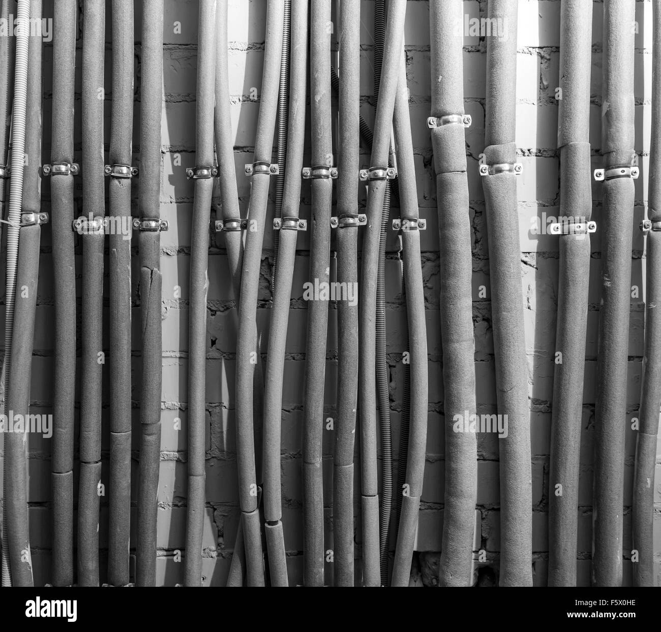 Wires in protection cover background Stock Photo - Alamy