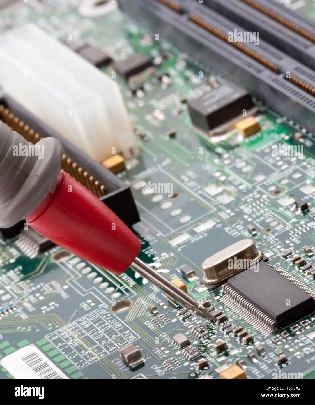 Probe of digital multimeter analyzing electronics circuit Stock Photo ...