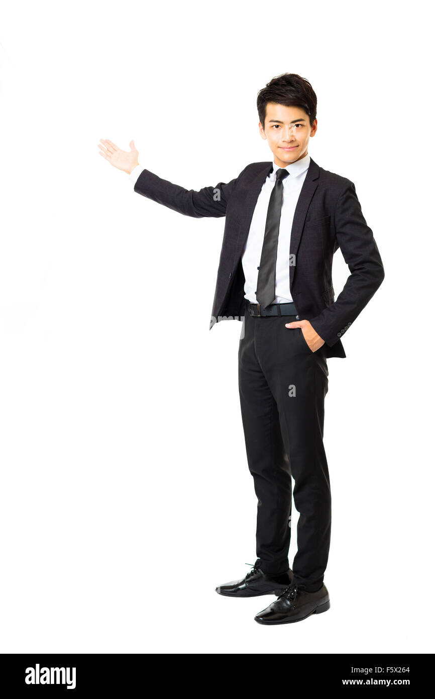 full length of young business man presenting something Stock Photo - Alamy
