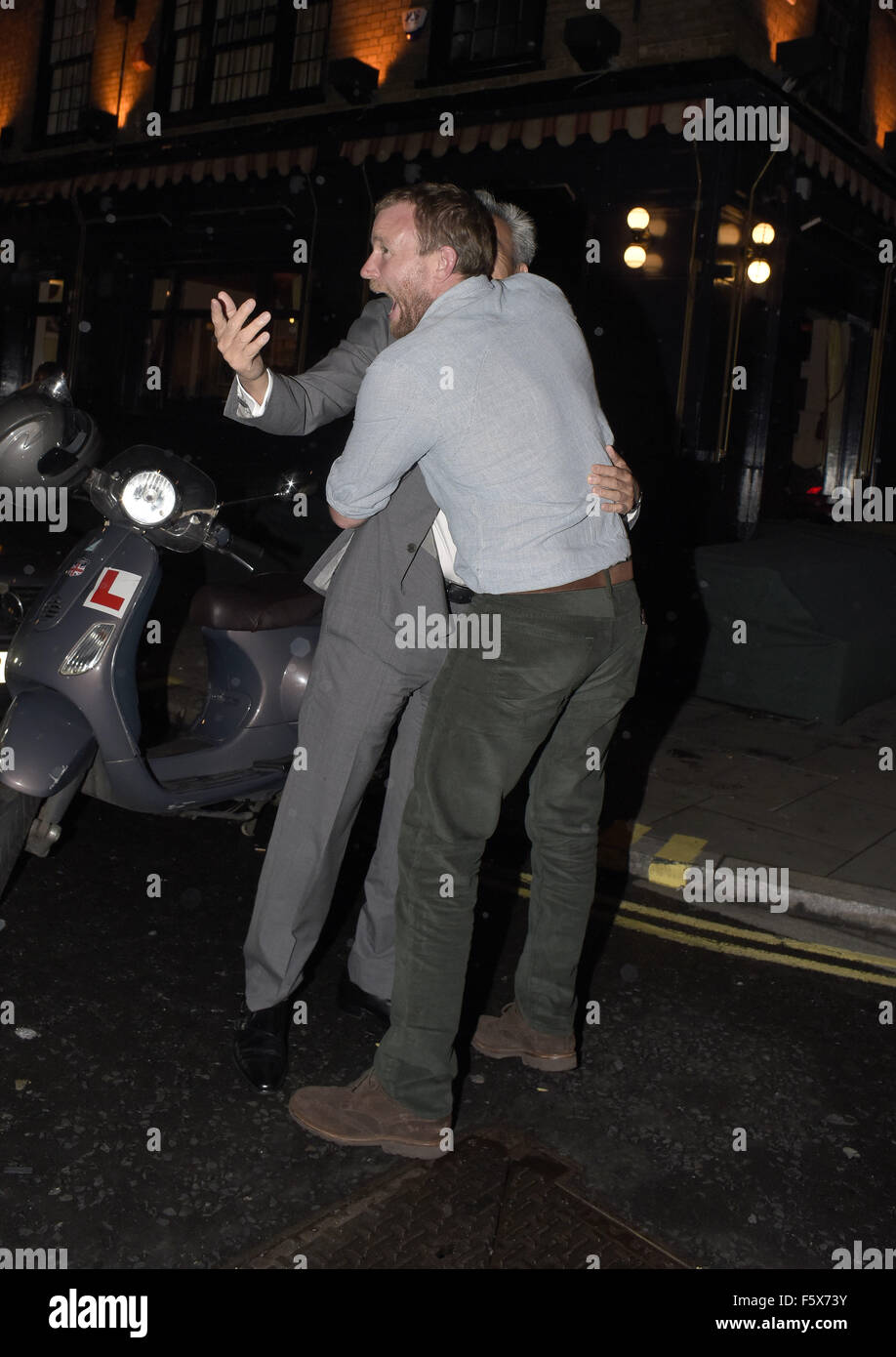 Guy Ritchie in a playful mood, hugging a friend when leaving Chiltern ...