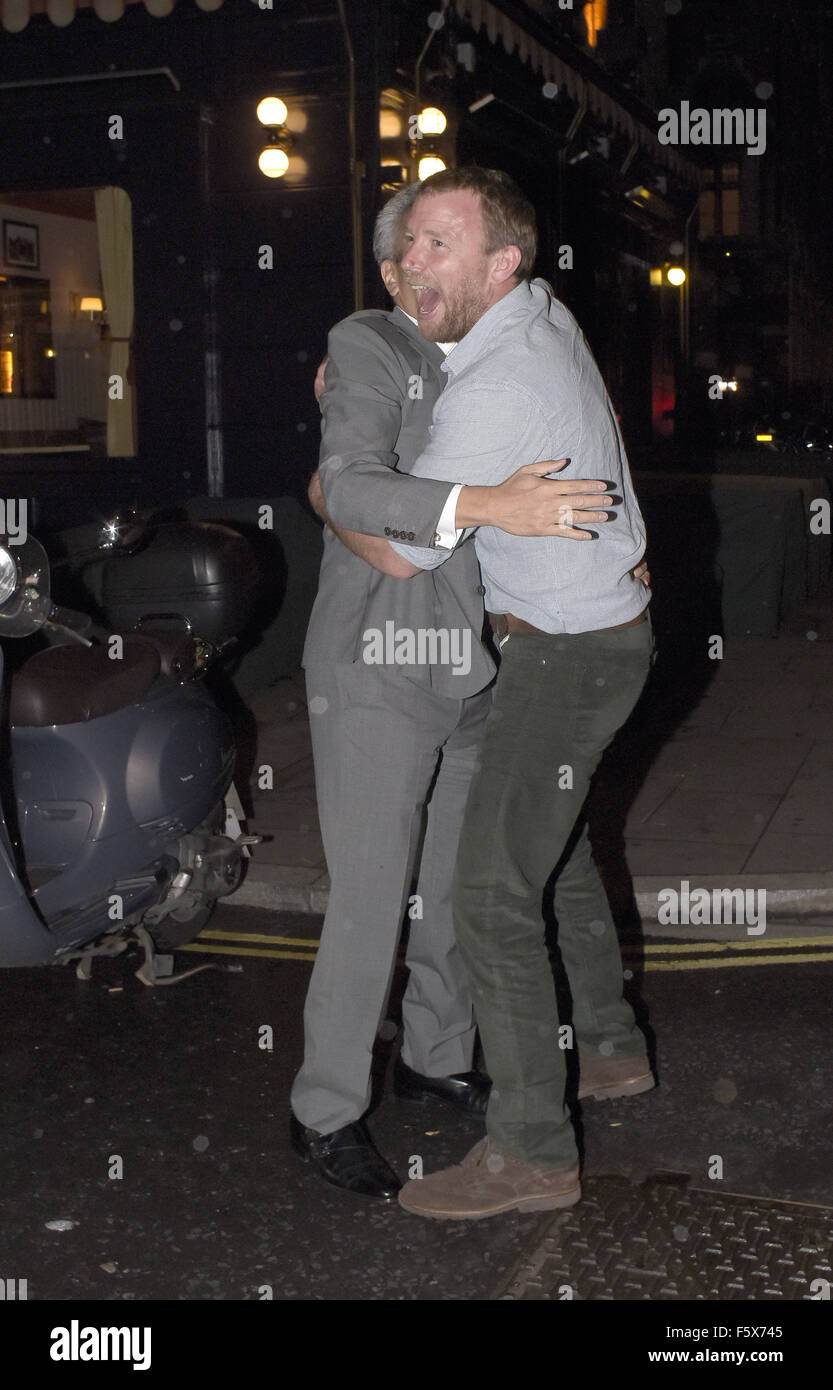 Guy Ritchie in a playful mood, hugging a friend when leaving Chiltern ...