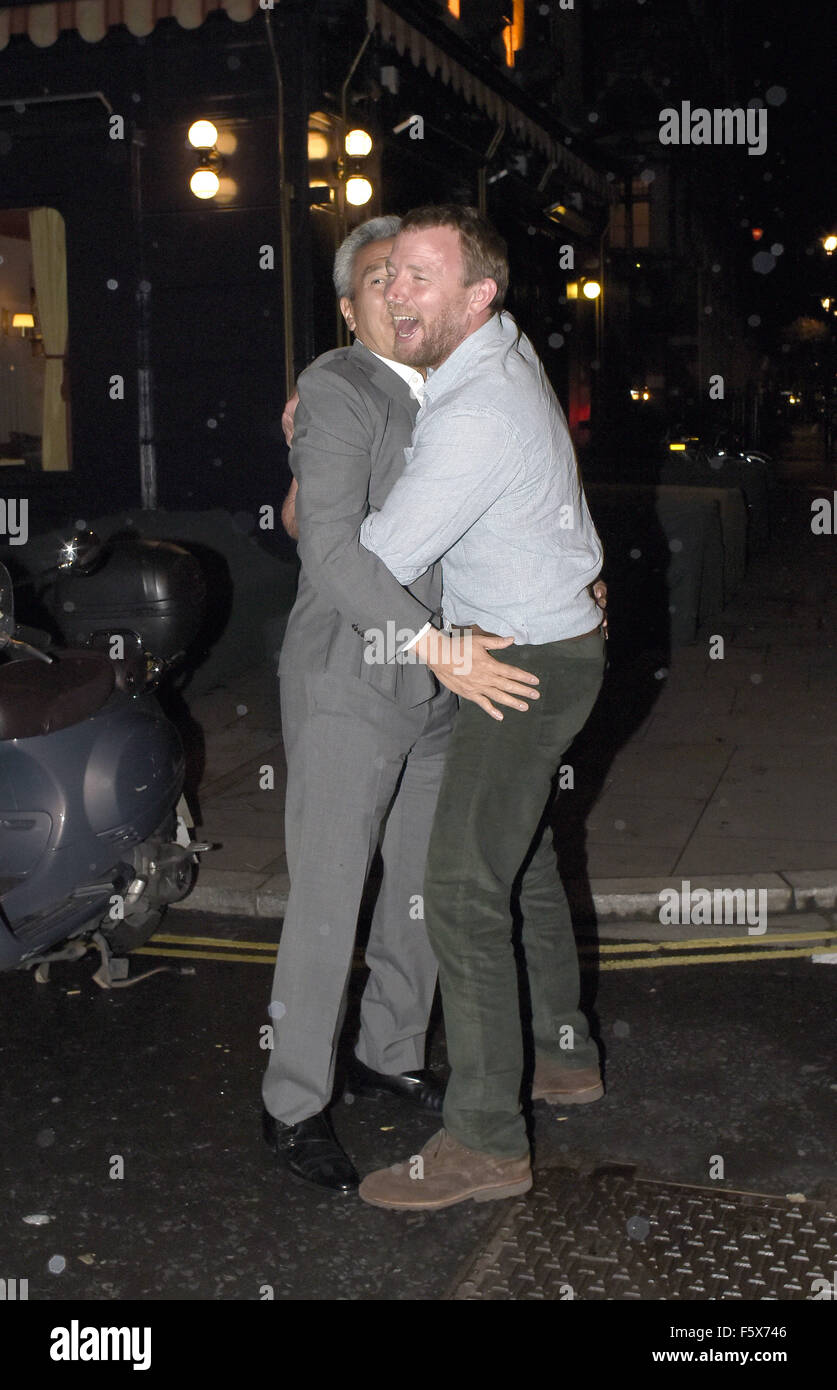 Guy Ritchie in a playful mood, hugging a friend when leaving Chiltern ...