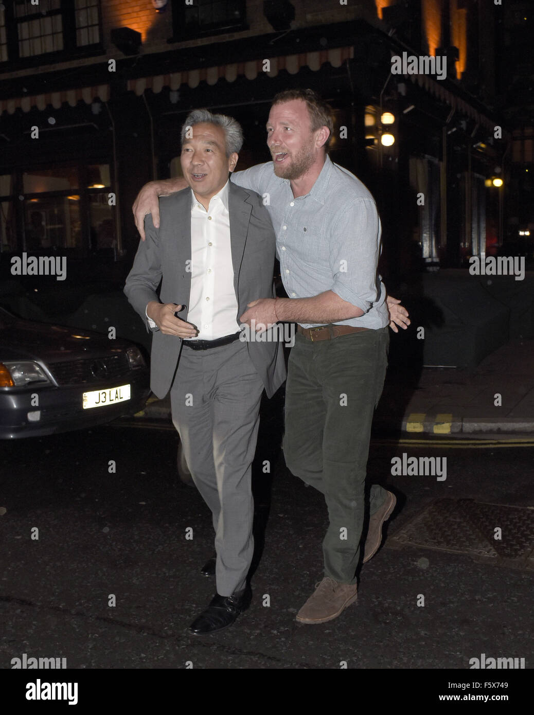 Guy Ritchie in a playful mood, hugging a friend when leaving Chiltern ...