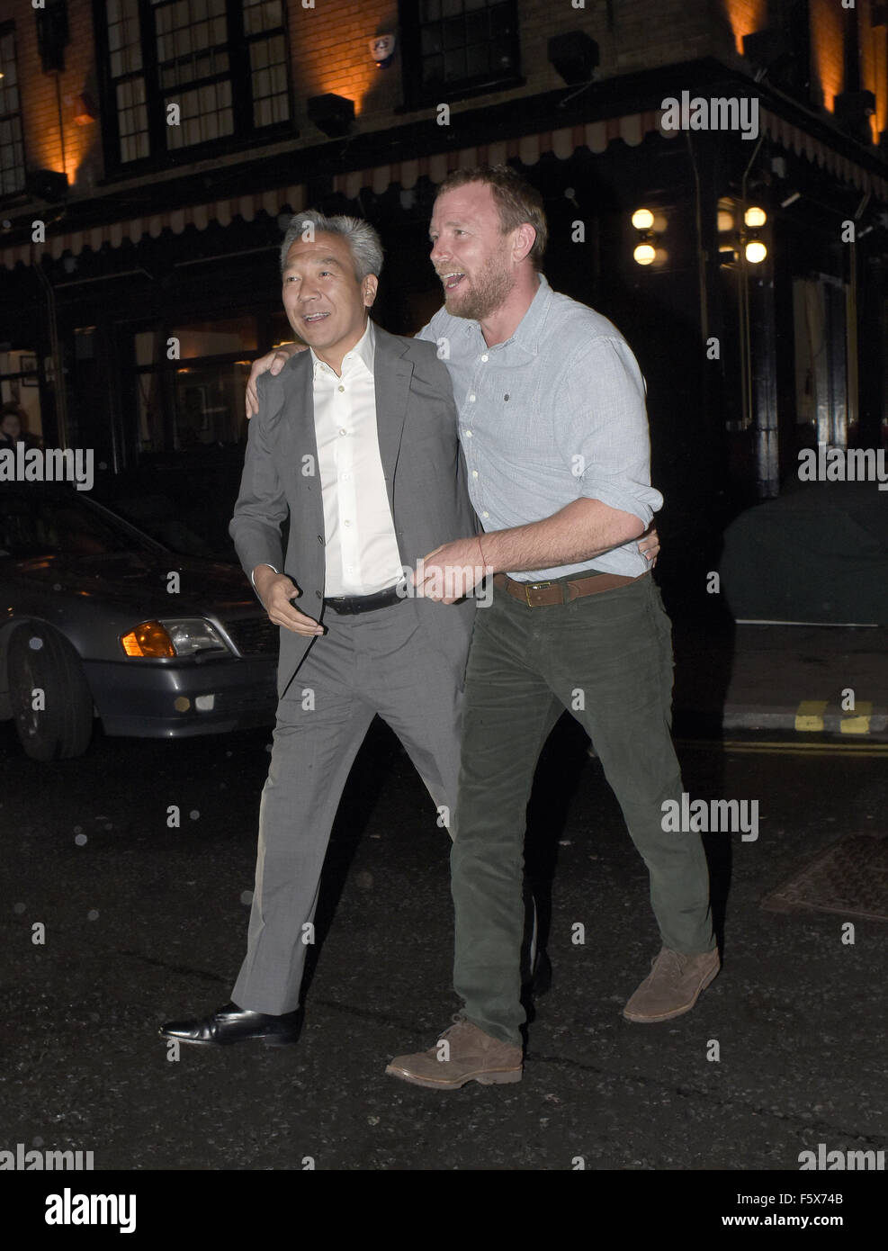 Guy Ritchie in a playful mood, hugging a friend when leaving Chiltern ...