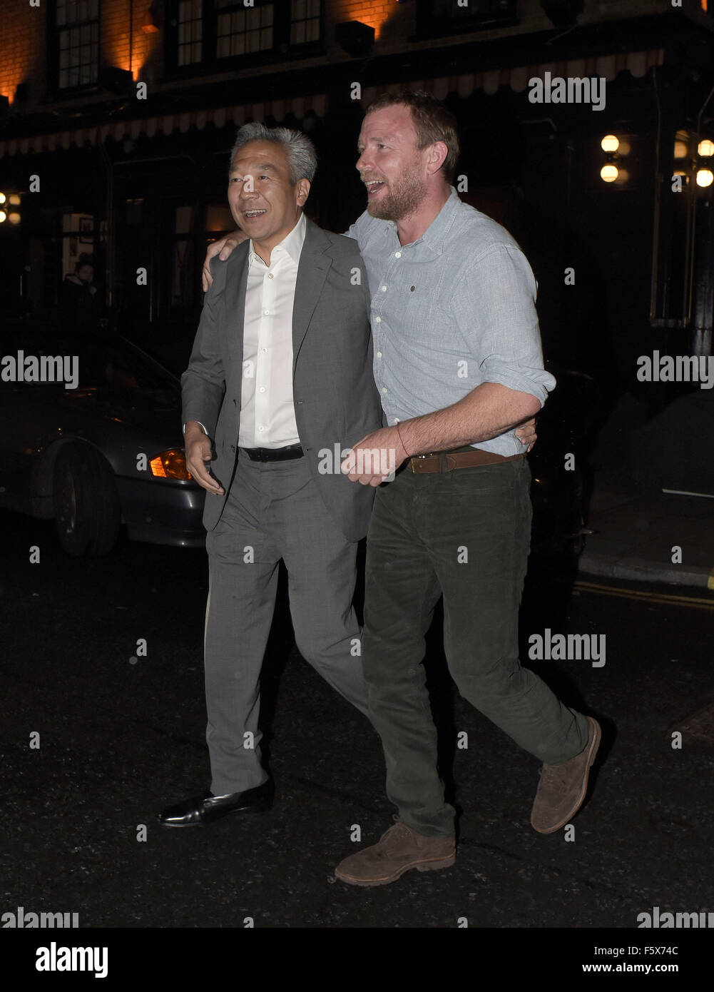 Guy Ritchie in a playful mood, hugging a friend when leaving Chiltern ...