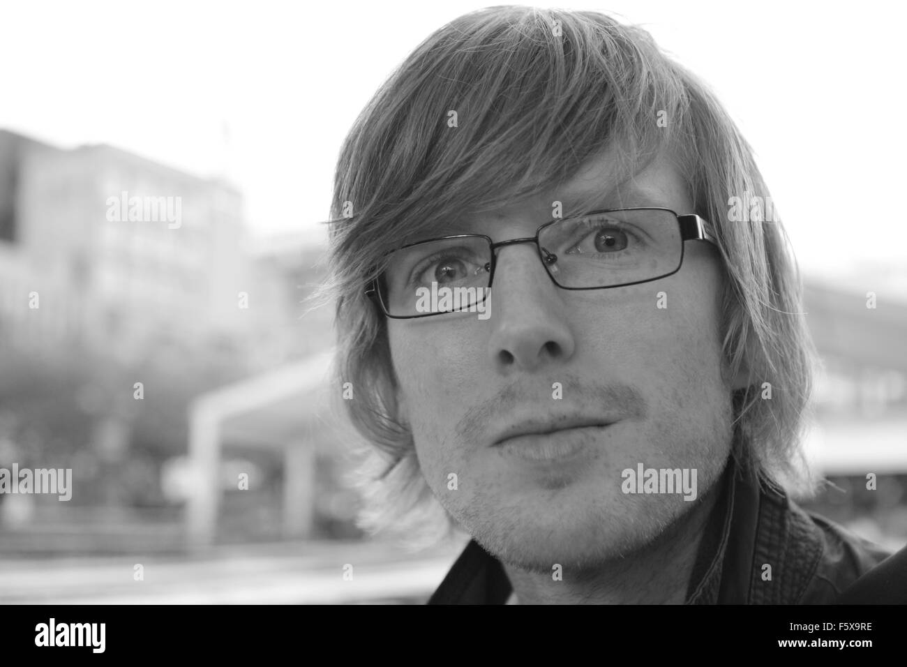Young man staring at the camera in black and white Stock Photo - Alamy