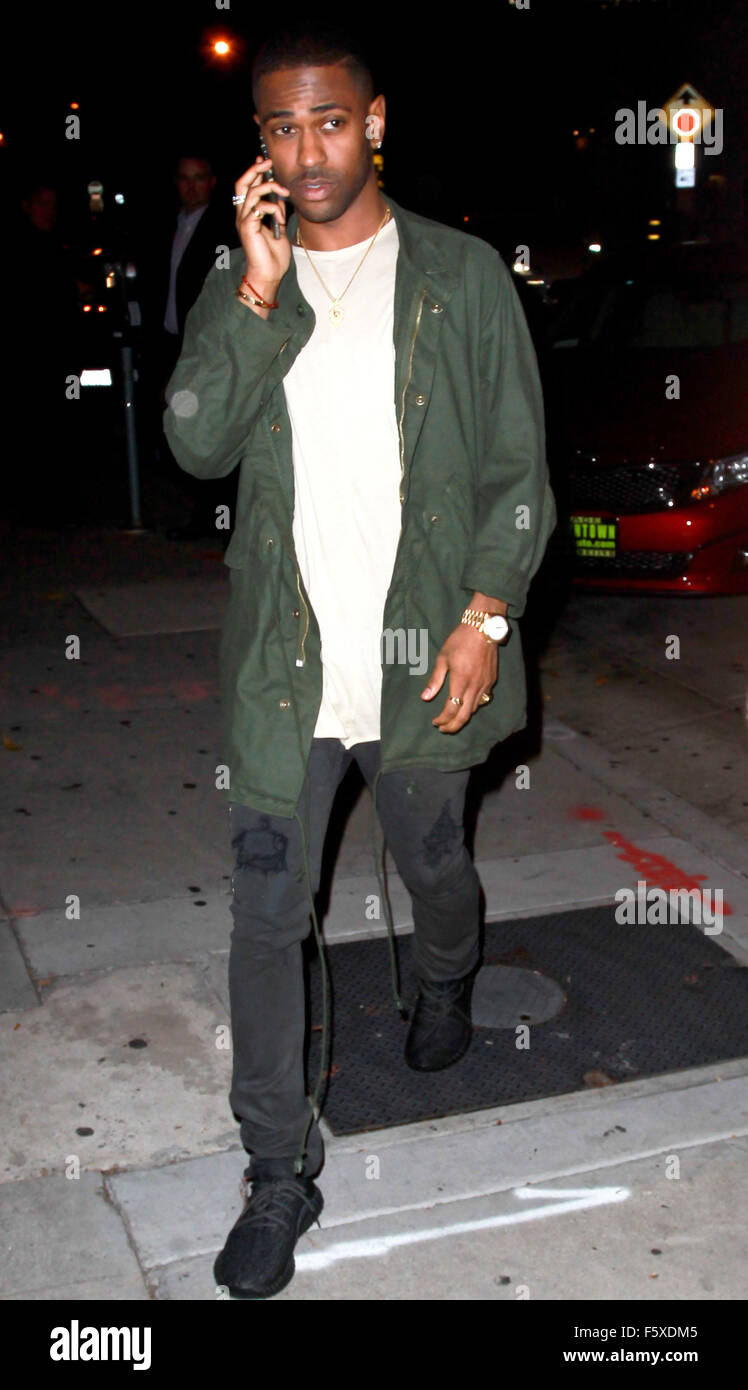 Rapper Big Sean chatting on his mobile phone as he arrives at Craig's ...