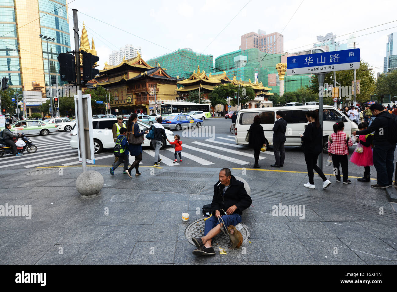 A Chinese man with his monkey in Shanghai,China Stock Photo - Alamy