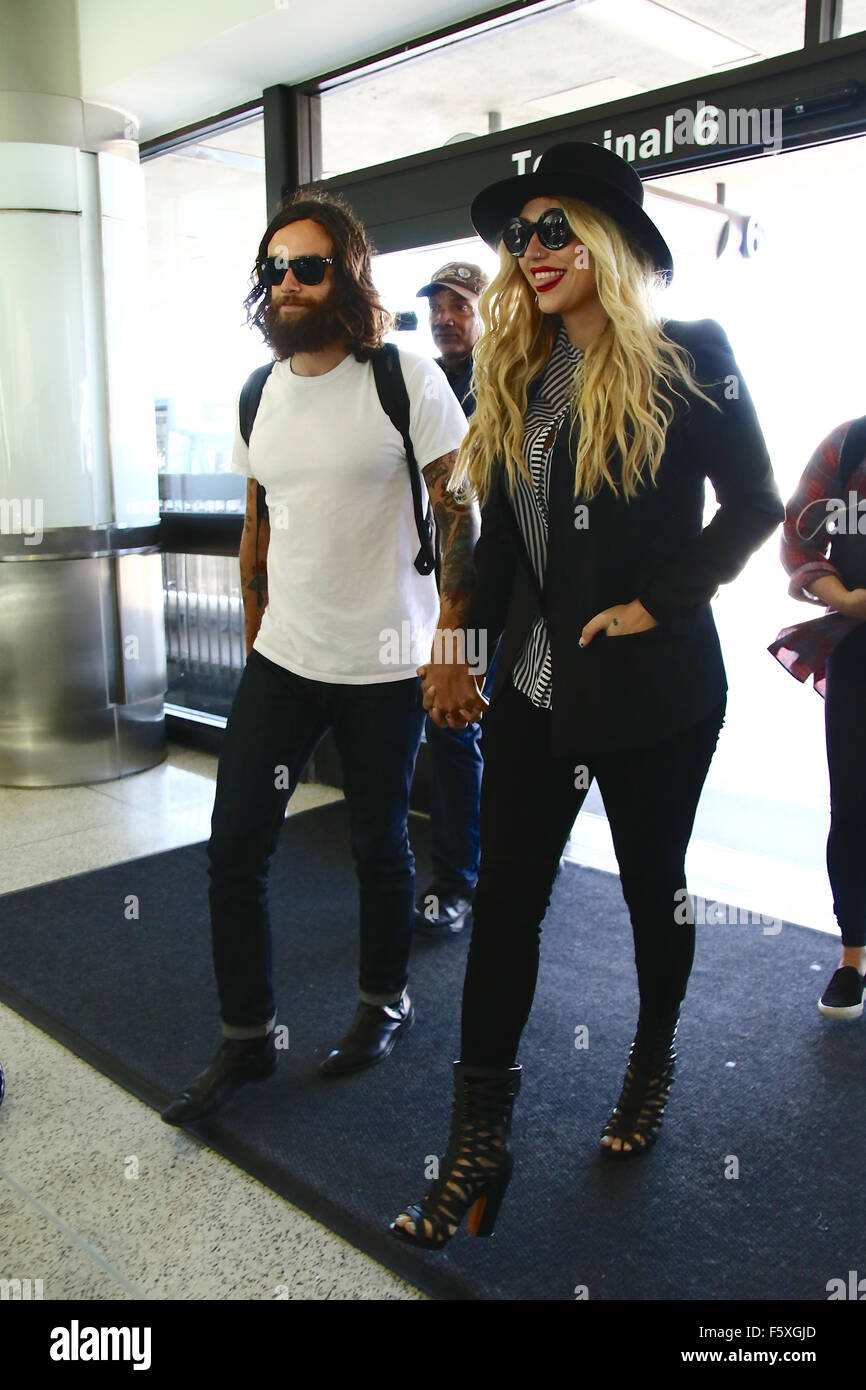 Kesha holds hands with her boyfriend Brad Ashenfelter at Los Angeles ...