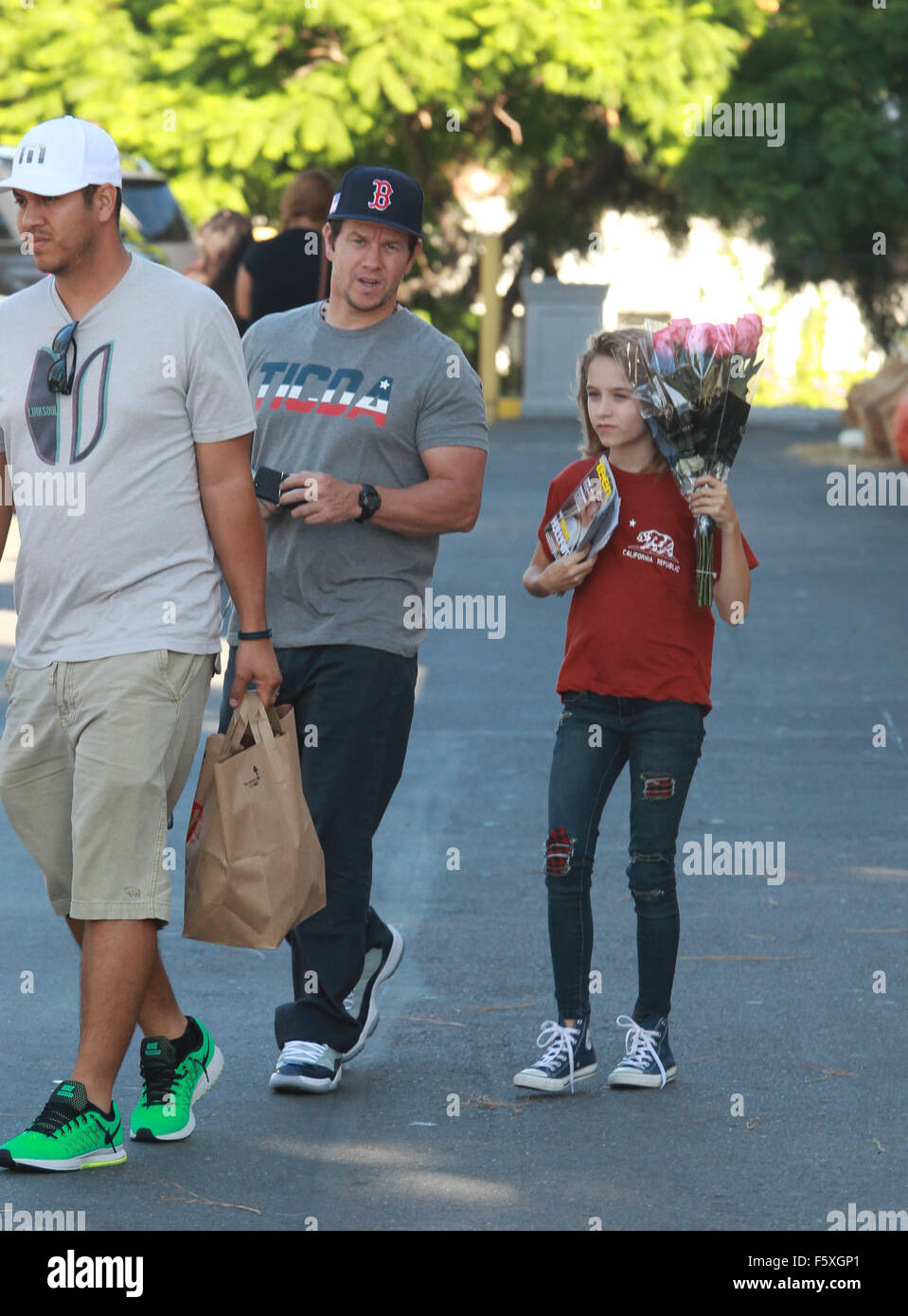 Mark Wahlberg and his daughter Ella Rae Wahlberg pick up red roses at ...