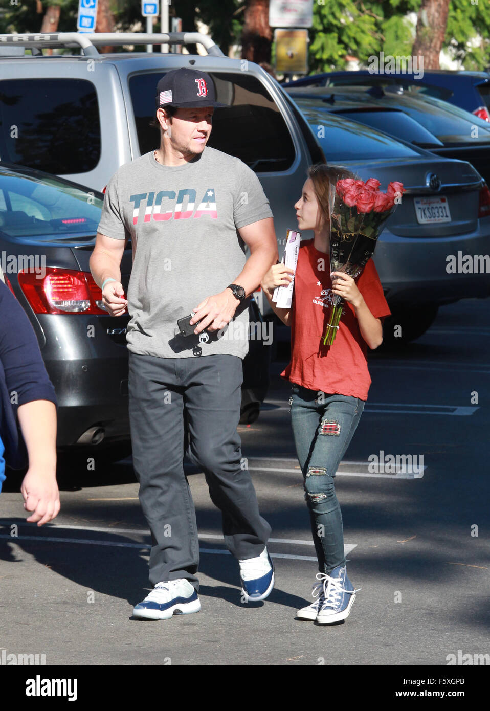 Mark Wahlberg and his daughter Ella Rae Wahlberg pick up red roses at ...
