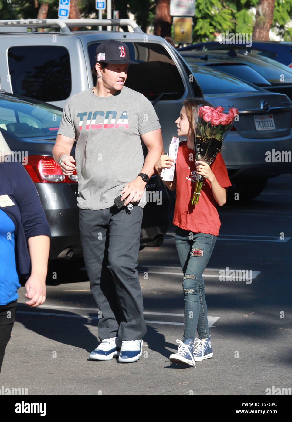 Mark Wahlberg and his daughter Ella Rae Wahlberg pick up red roses at ...