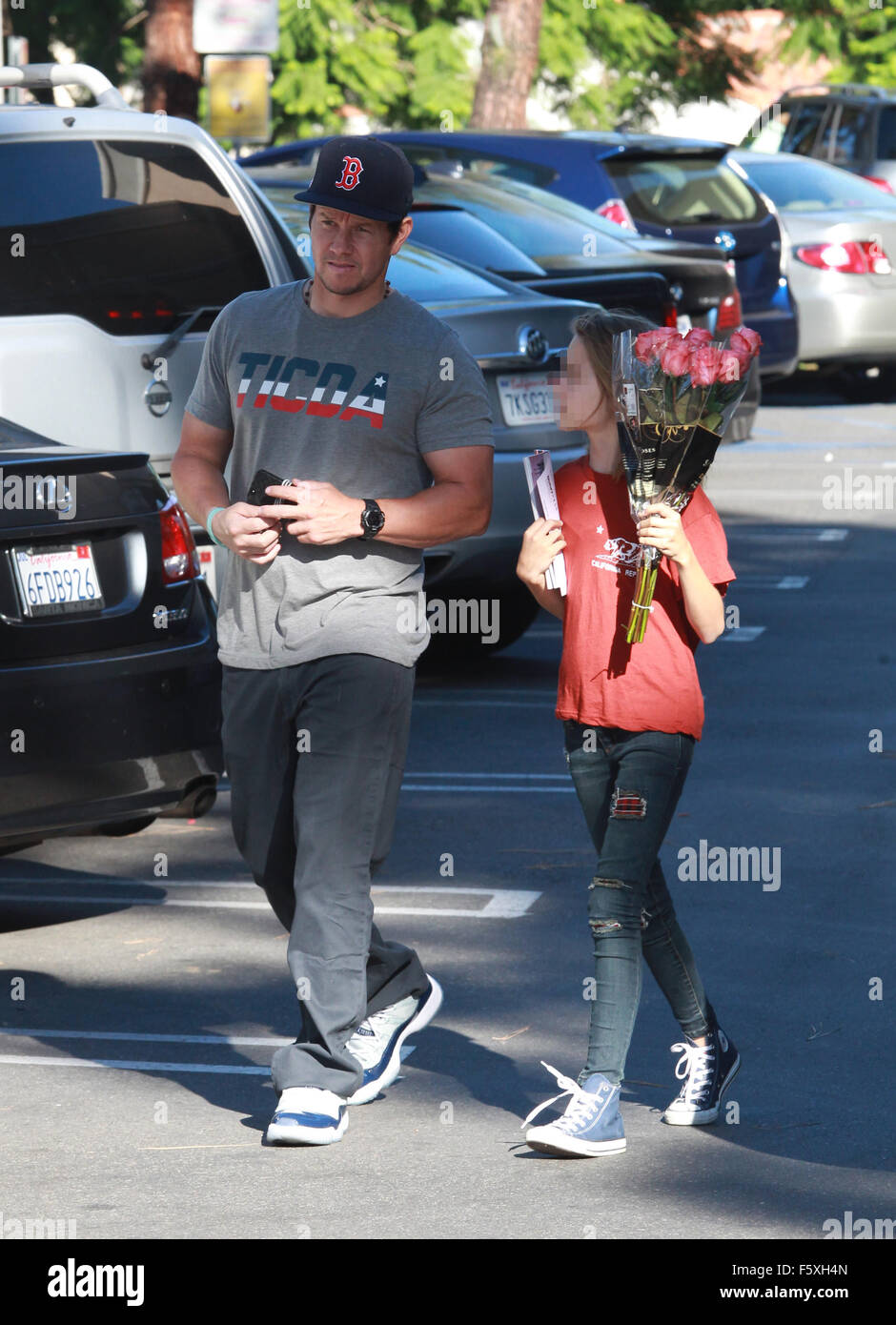 Mark Wahlberg and his daughter Ella Rae Wahlberg pick up red roses at ...