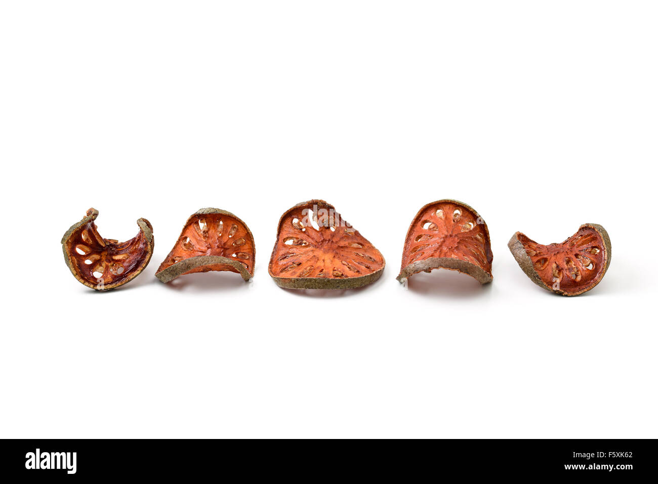 row of dried quince on white background Stock Photo - Alamy