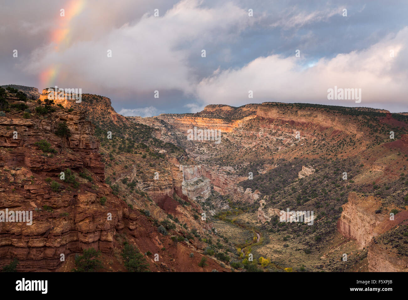 A rainbow arching over the Fremont River Gorge, Capitol Reef National ...