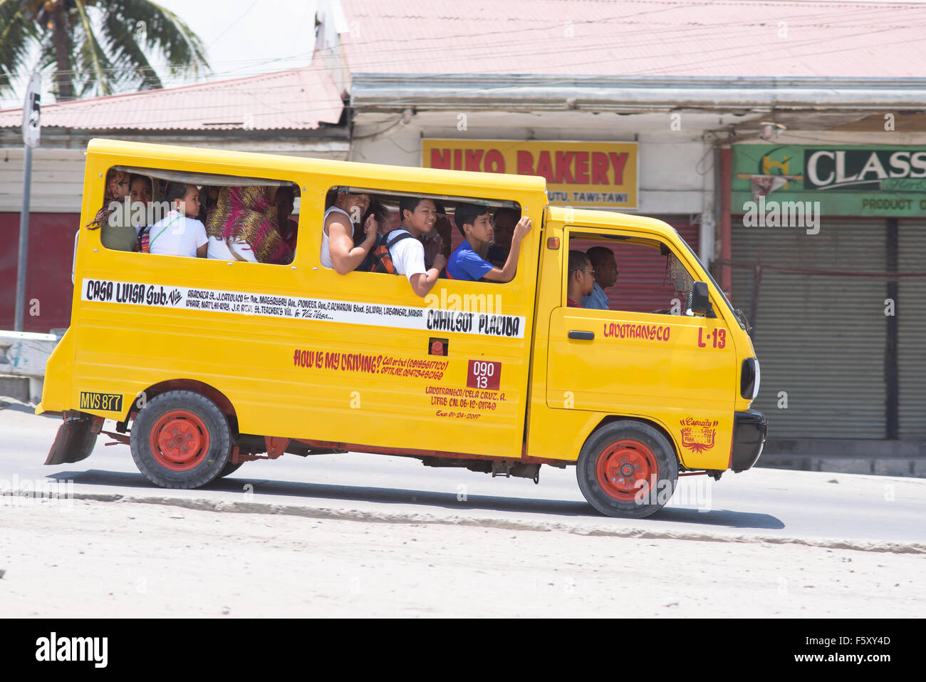 Local bus, a modern variety of the classic jeepney, with passengers in ...