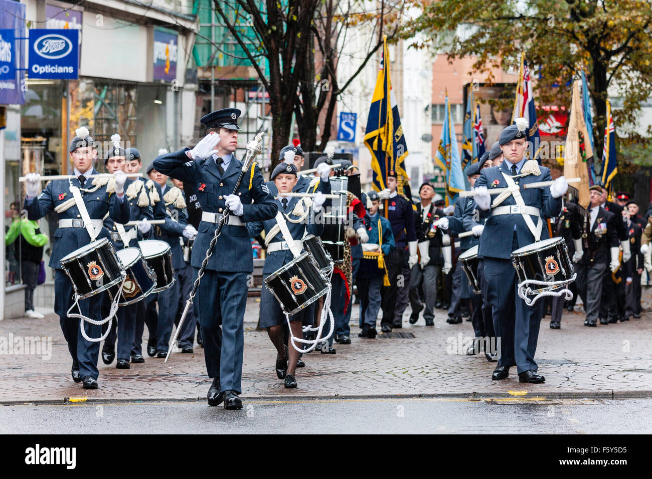 England. Remembrance Day. Drum Major saluting while leading performing ...