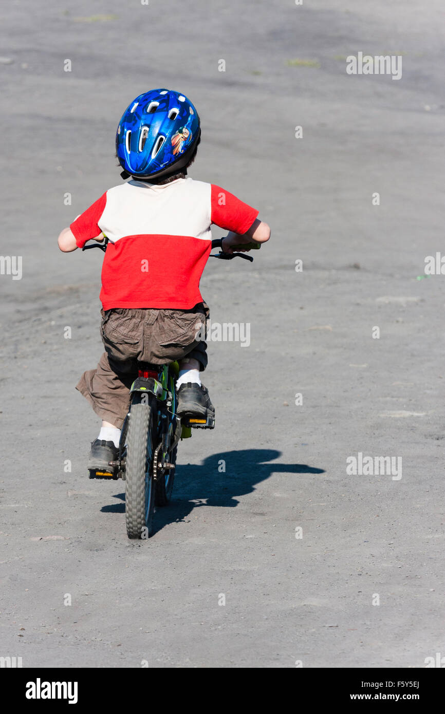 Child rides away on bike hi-res stock photography and images - Alamy